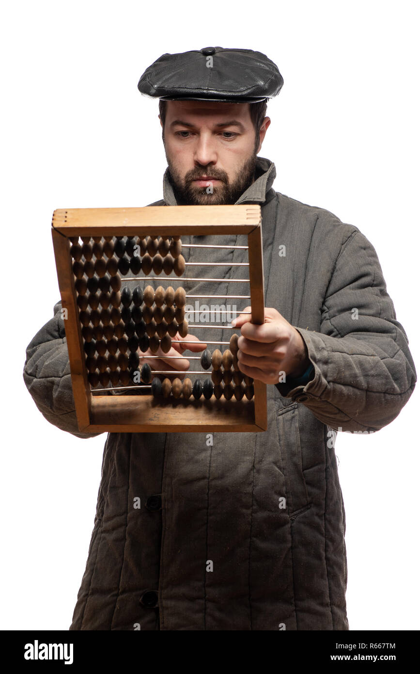 Old fashioned bearded man counts on retro wooden abacus, studio shot ...