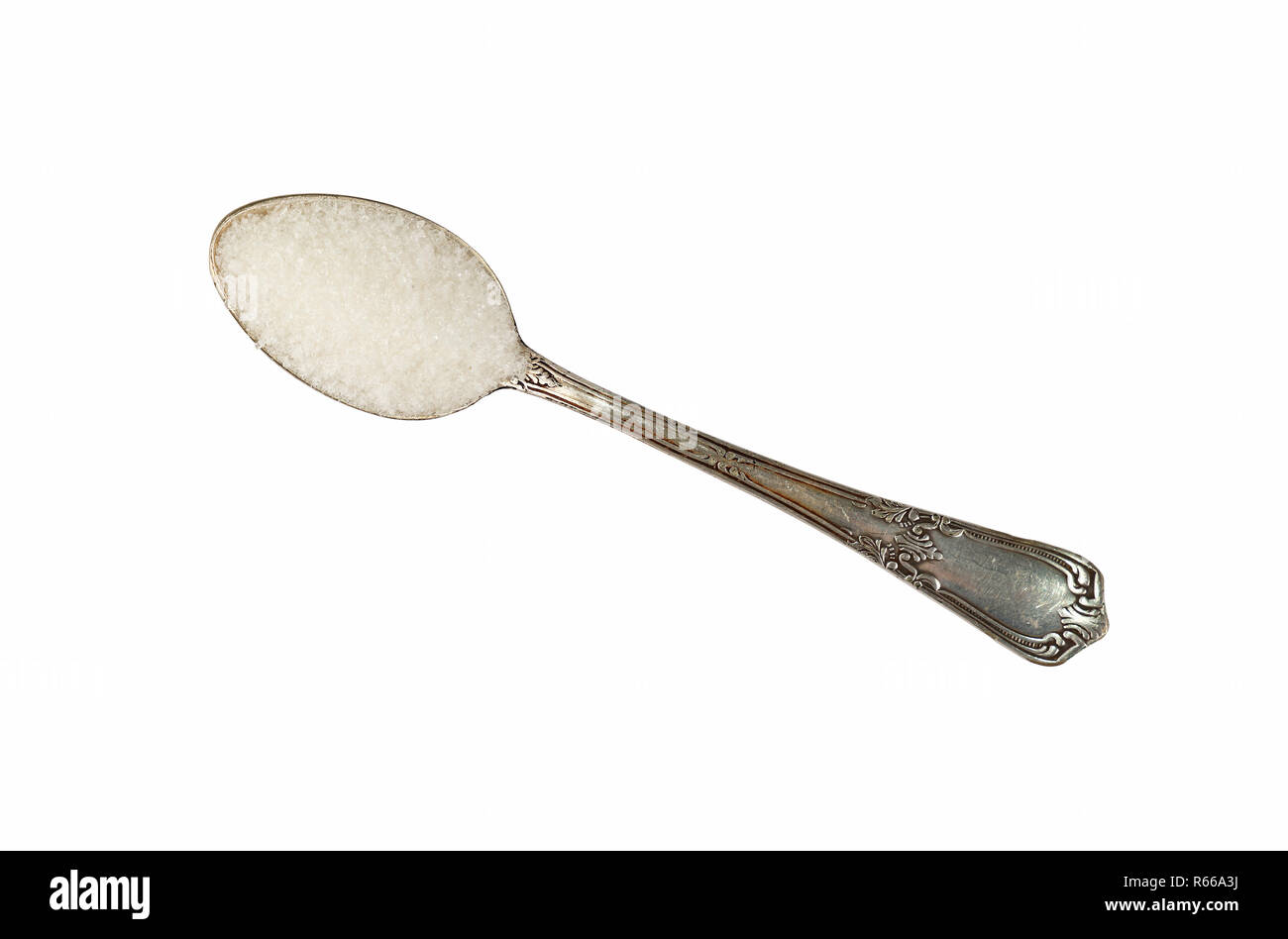 Vintage metal spoon full of white sugar isolated Stock Photo - Alamy