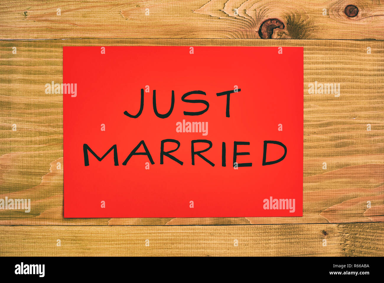Text just married on the red paper on wooden table Stock Photo - Alamy