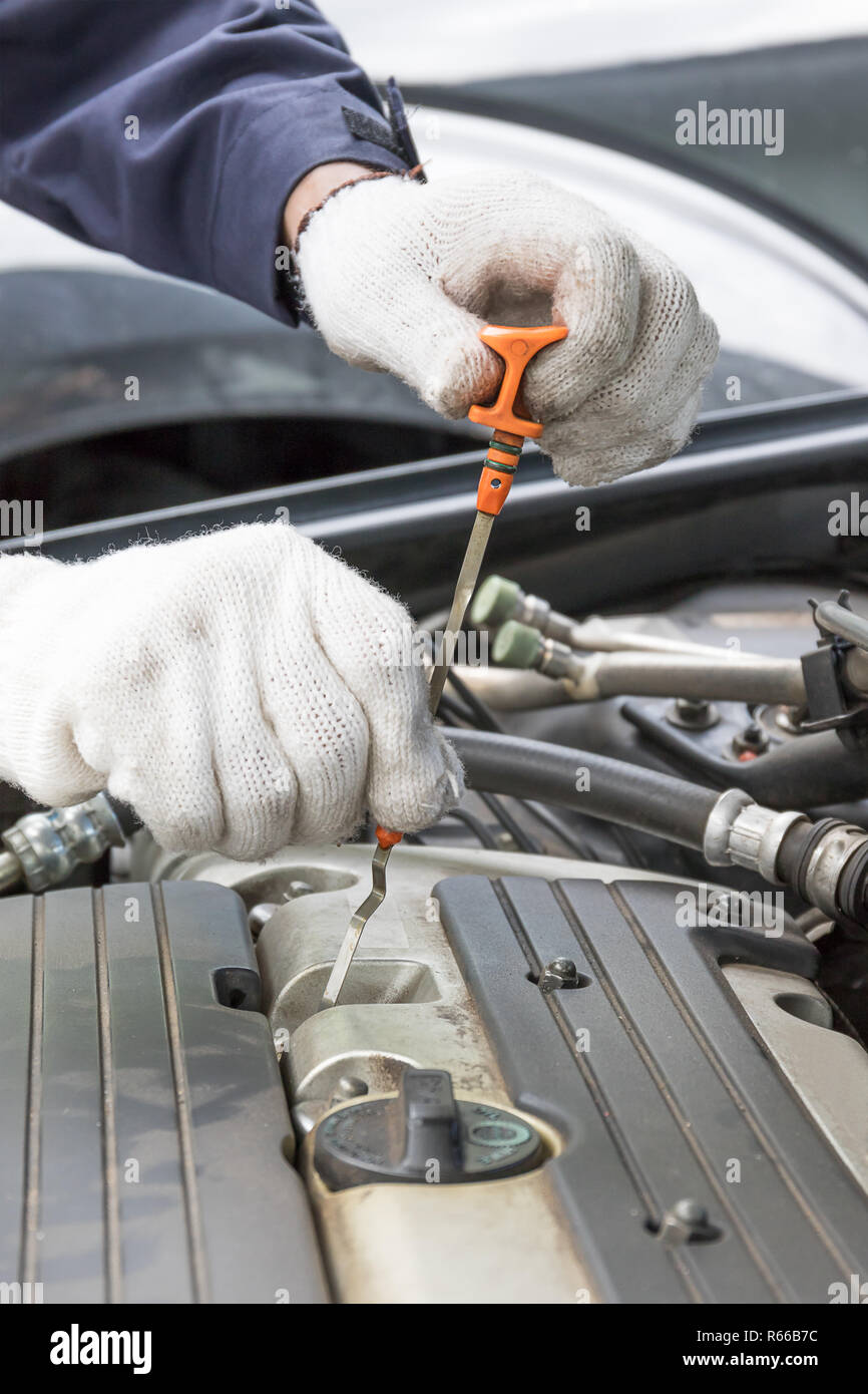 Auto mechanic check engine car Stock Photo - Alamy