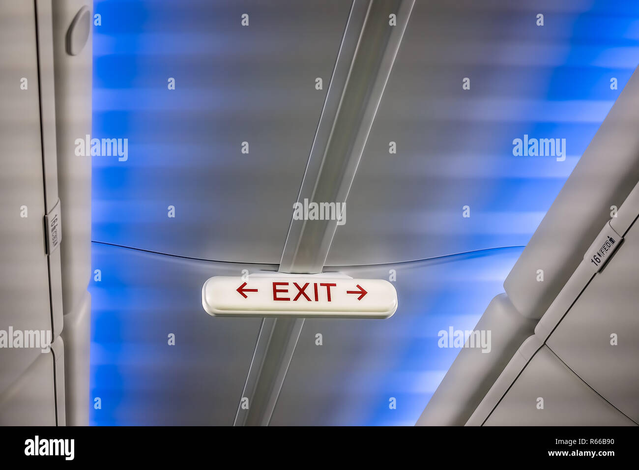 Emergency Exit Sign inside a plane Stock Photo - Alamy