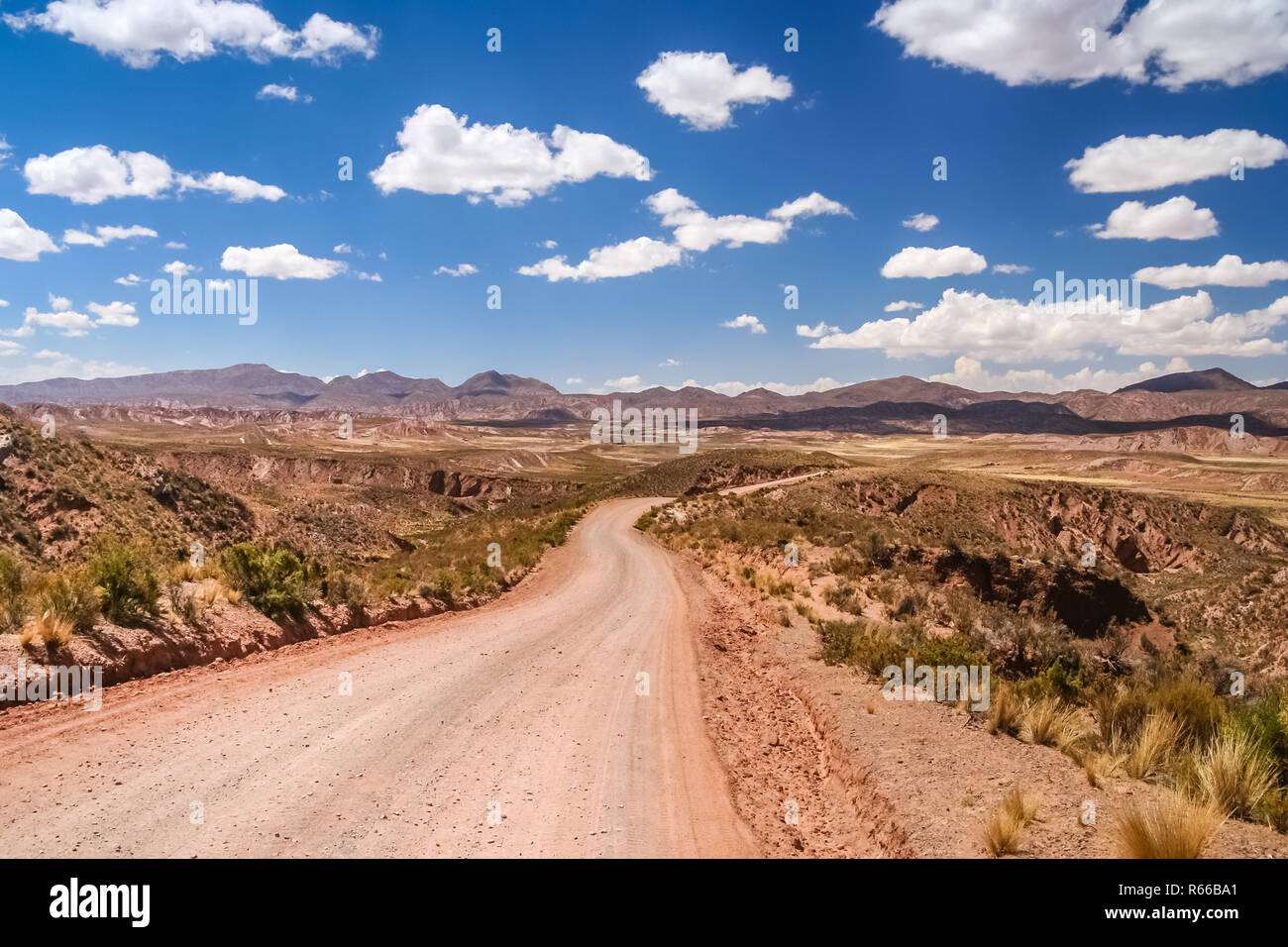 Winding sandy road through mountain hi-res stock photography and images ...