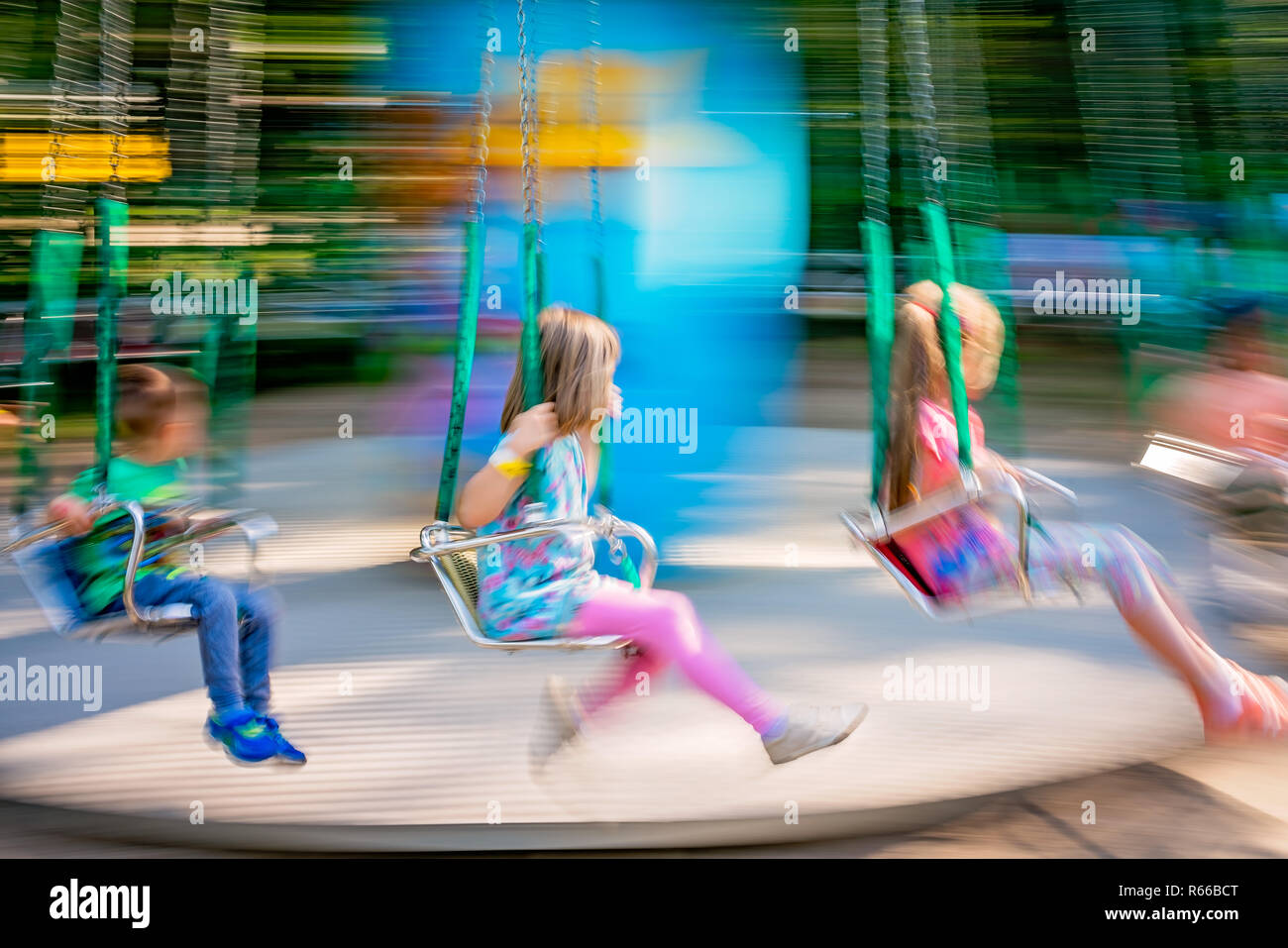 Children on a carousel Stock Photo - Alamy