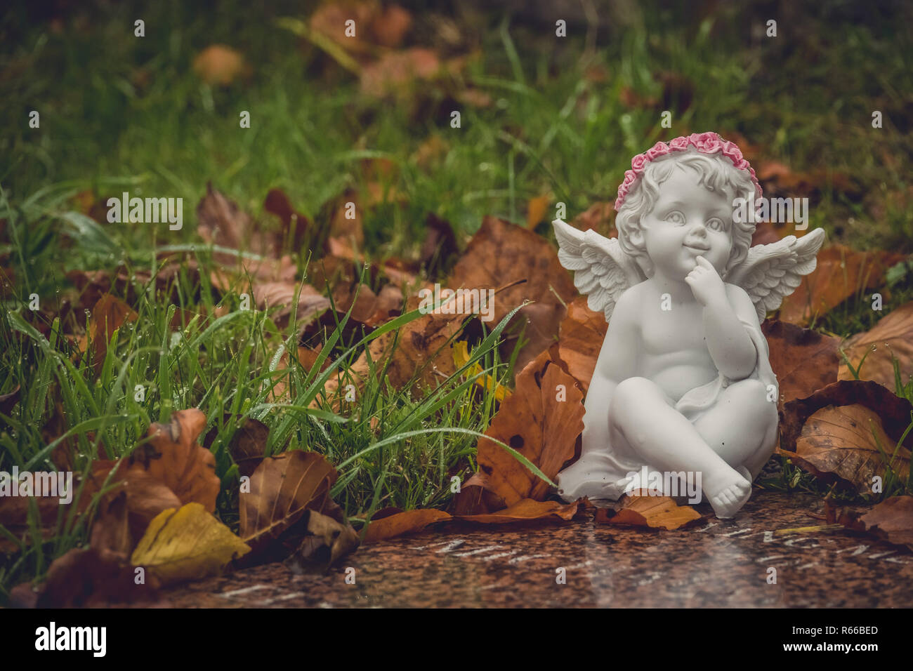 Tiny baby angel figure Stock Photo - Alamy