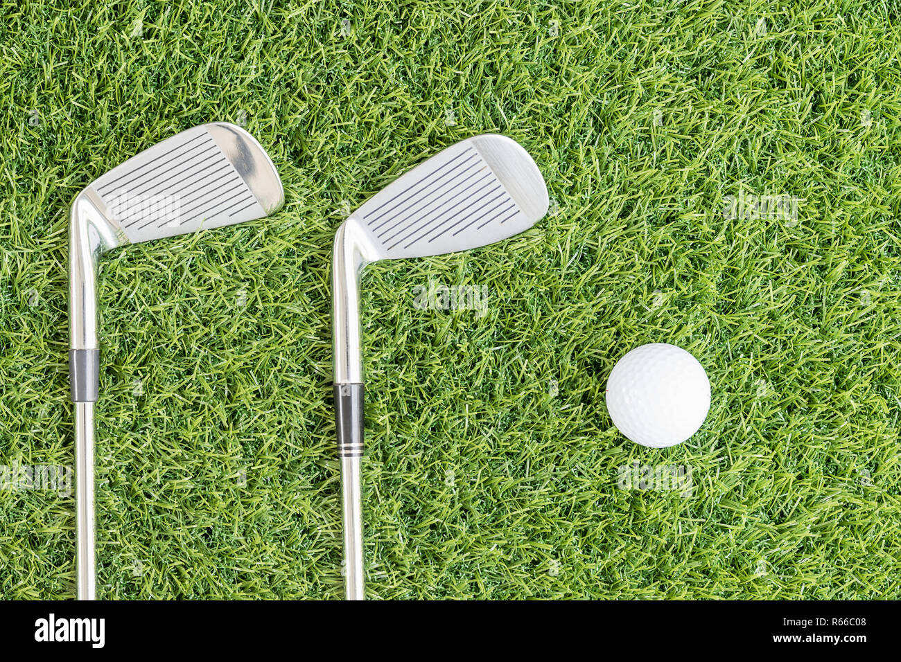 Golf club and Golf ball on green grass Stock Photo - Alamy