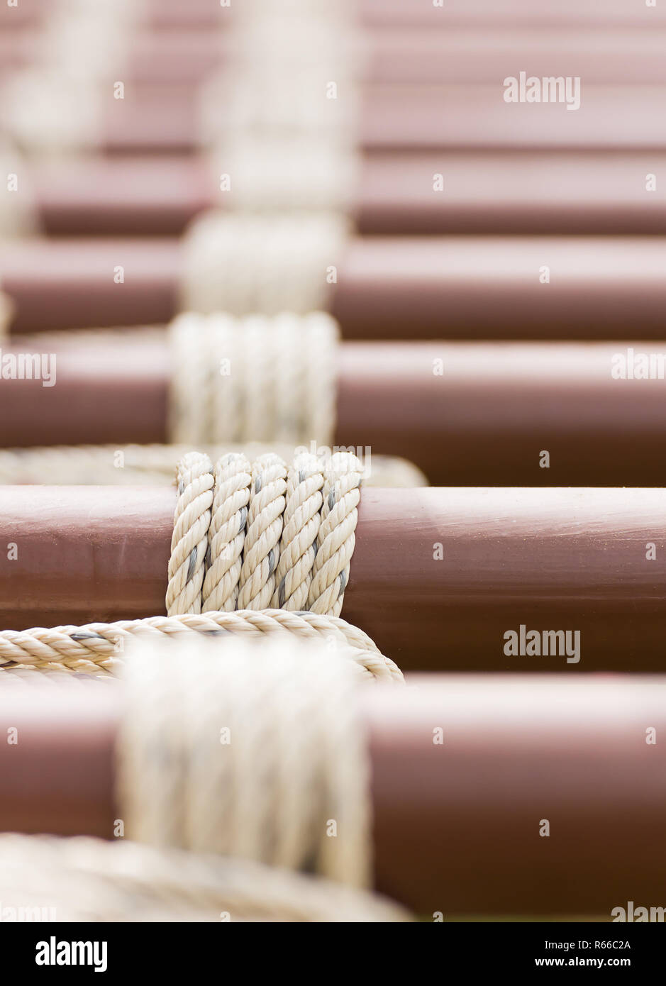 Rope knot around metal pipe Stock Photo - Alamy