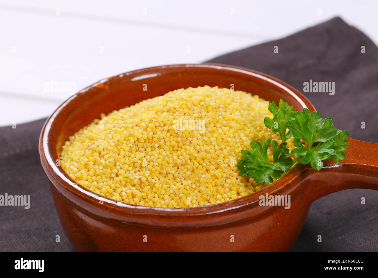 saucepan of raw millet grains Stock Photo - Alamy