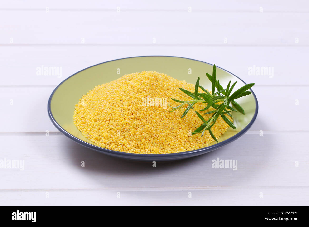 plate of raw millet grains Stock Photo - Alamy