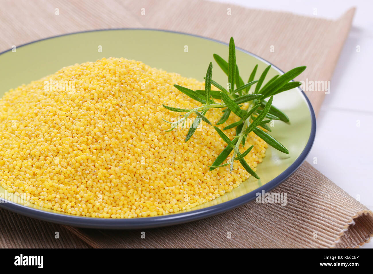 plate of raw millet grains Stock Photo - Alamy