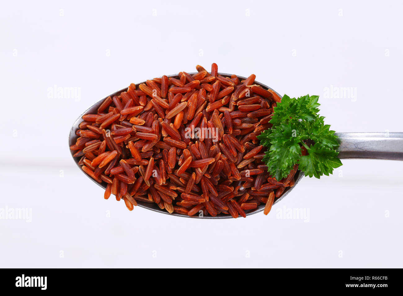 spoon of red rice Stock Photo - Alamy