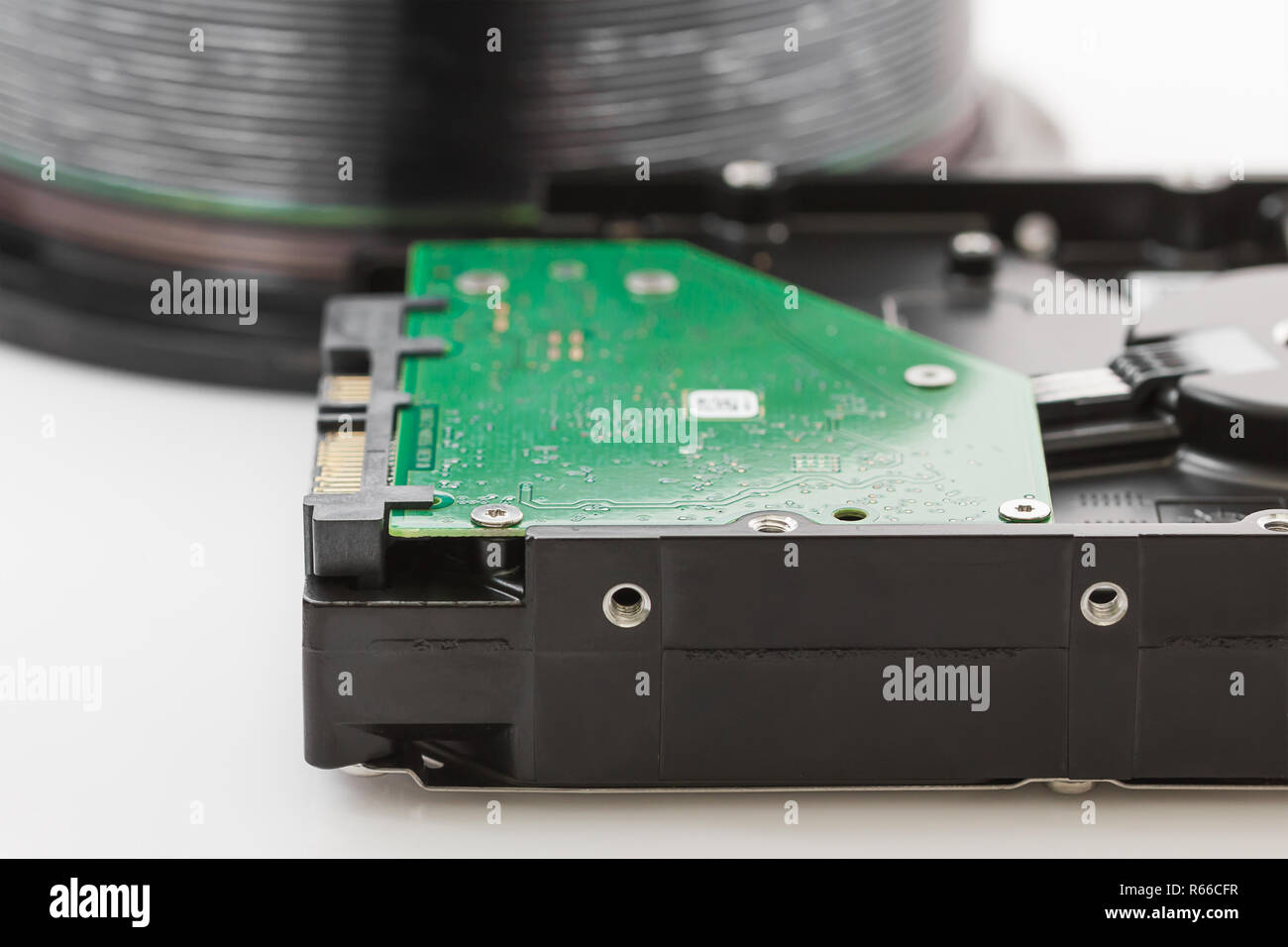 Hard disk drive and compact discs Stock Photo - Alamy
