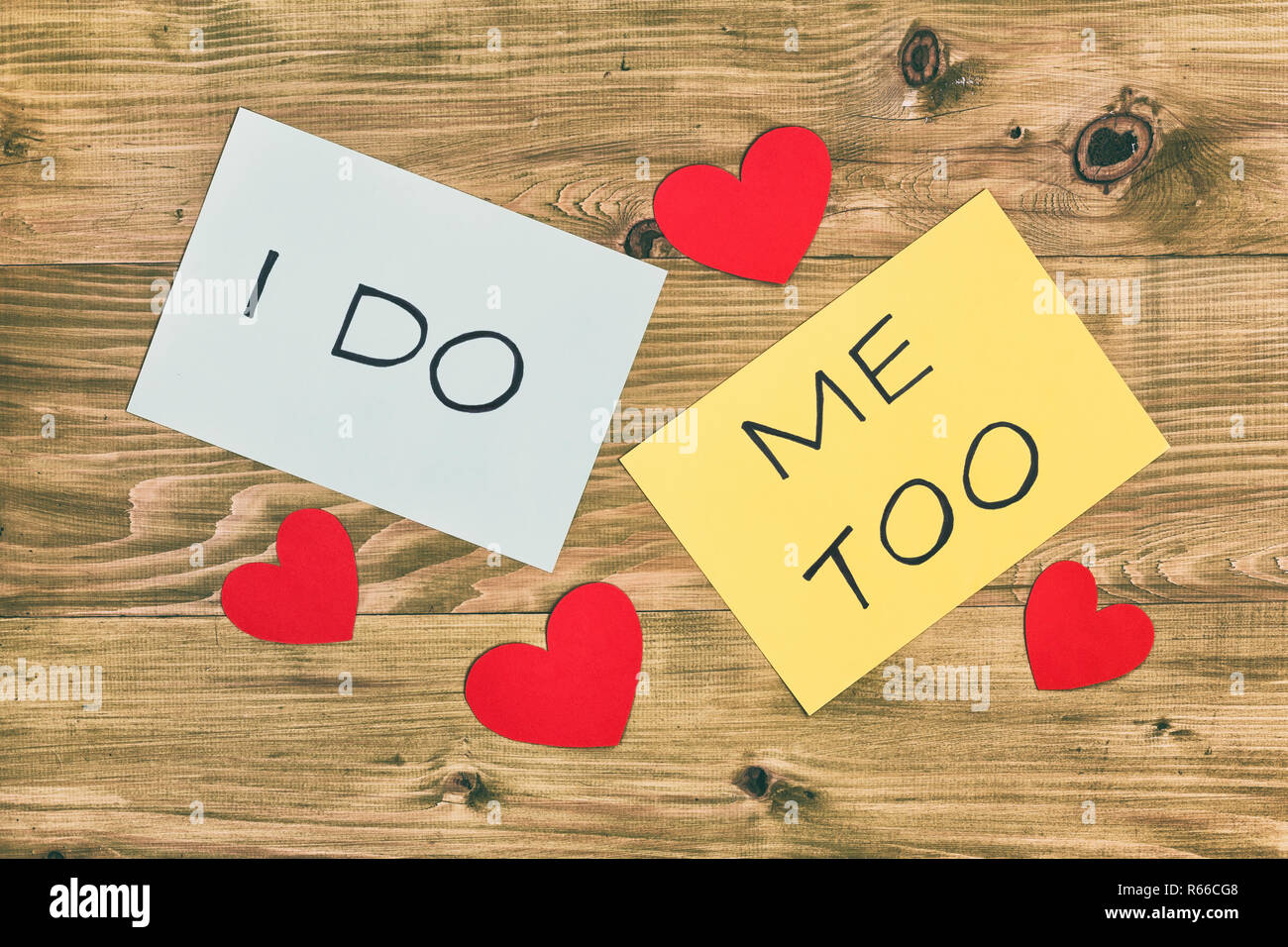 Photo of papers with text i do and me too on wooden table Stock Photo ...
