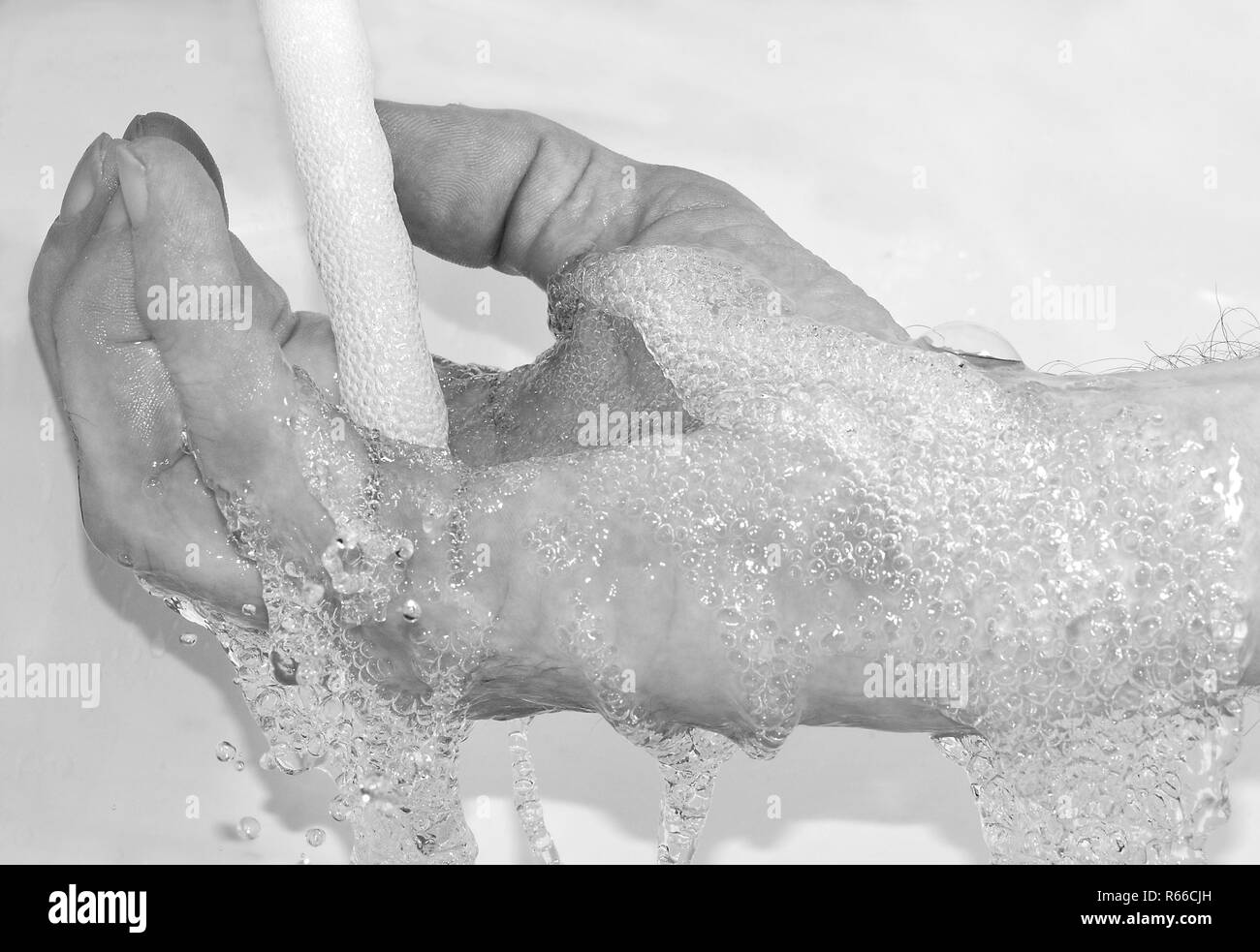 hand in the water jet Stock Photo - Alamy