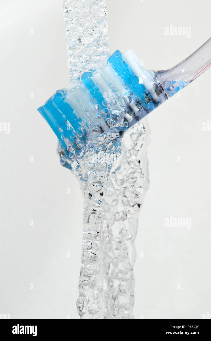 toothbrush in the water jet Stock Photo - Alamy