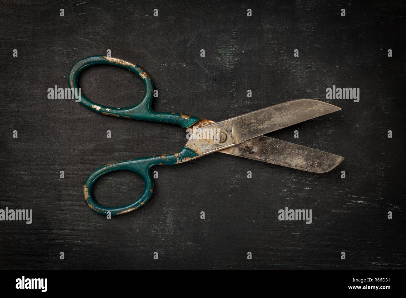 Vintage scissors on black wooden background Stock Photo - Alamy