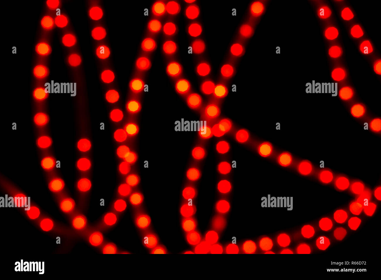 Blurry red spherical lights on black background Stock Photo - Alamy