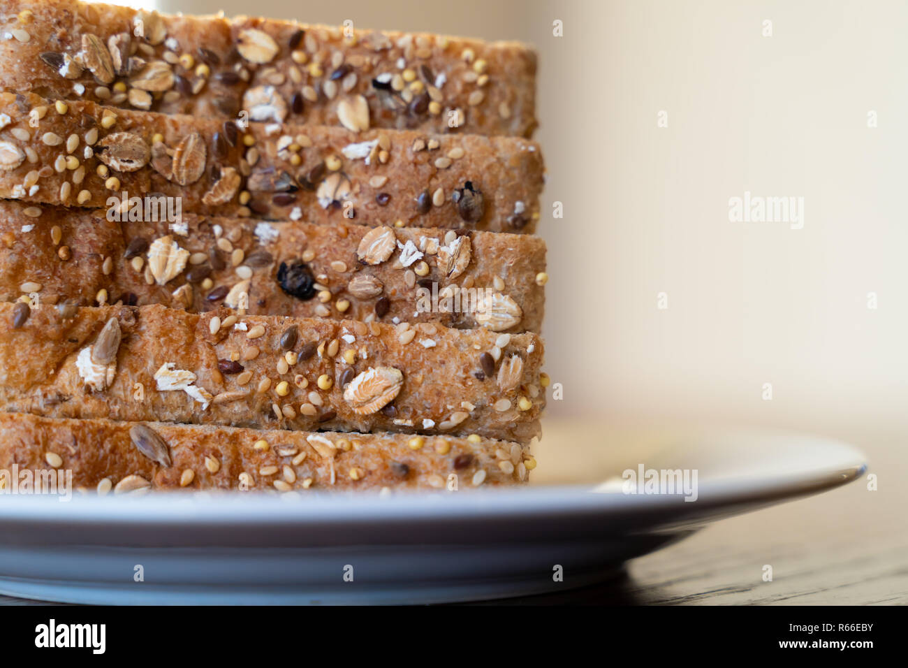 Slices of Whole grain bread on white plate Stock Photo - Alamy