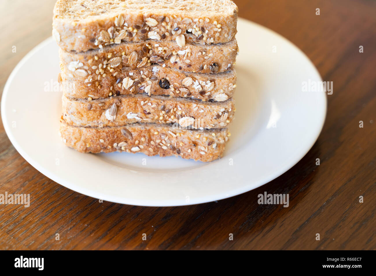 Slices of Whole grain bread on white plate Stock Photo - Alamy