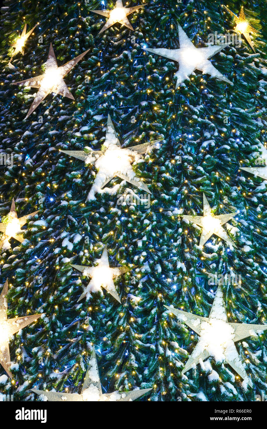 Christmas tree decorated with stars as background Stock Photo - Alamy