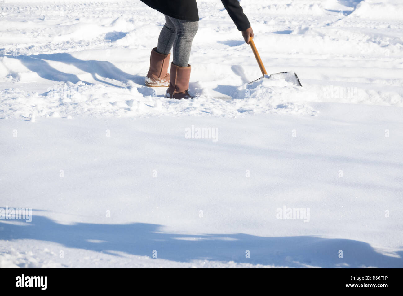 Woman shovel snow hi-res stock photography and images - Alamy