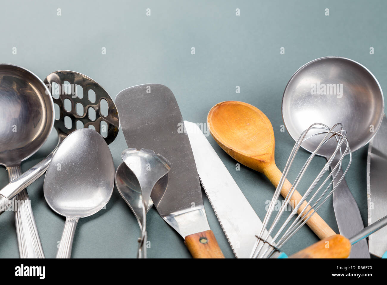 Used home kitchenware with scratches on gray paper background Stock ...