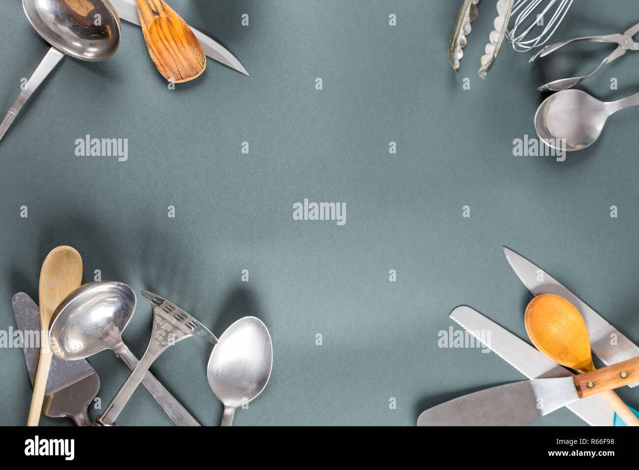 Used home kitchenware with scratches on gray paper background Stock ...