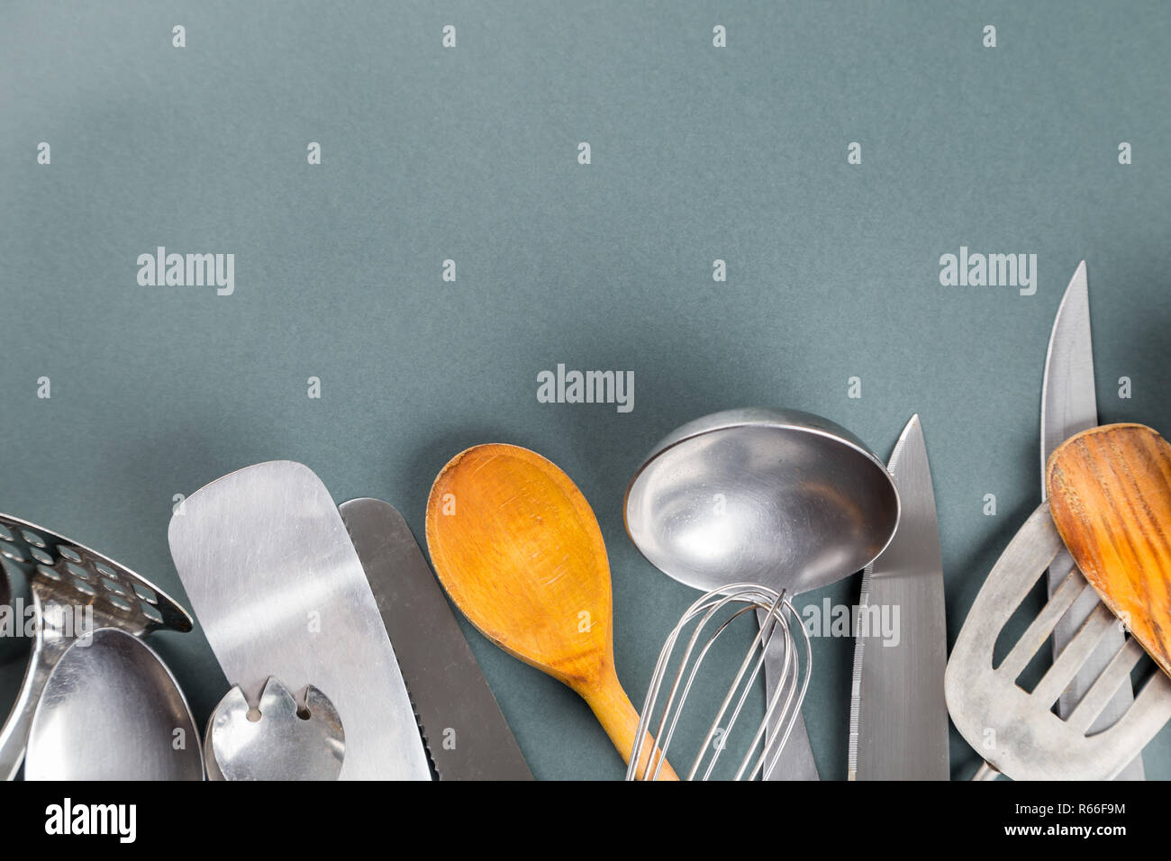 Used home kitchenware with scratches on gray paper background Stock ...