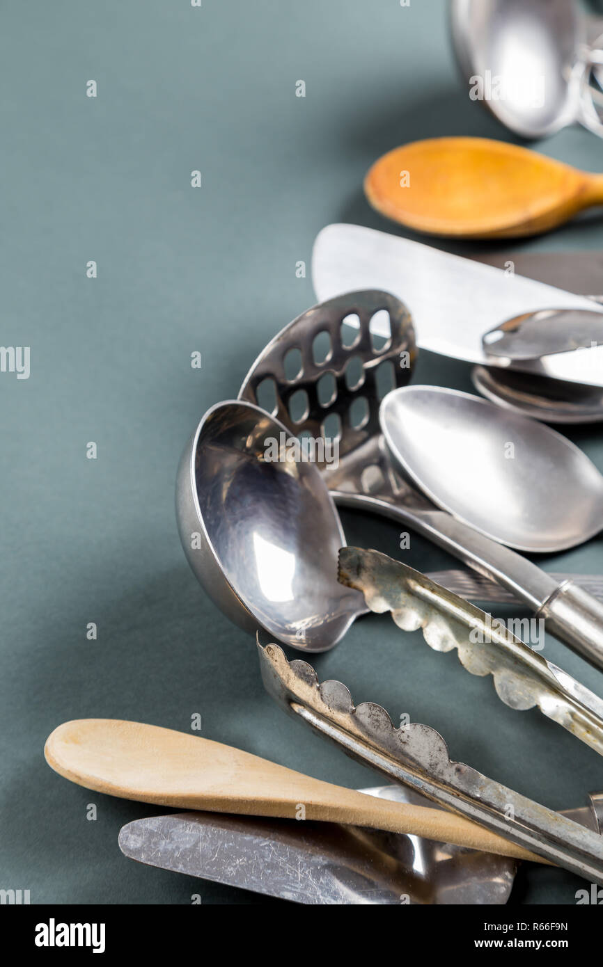 Used home kitchenware with scratches on gray paper background Stock ...