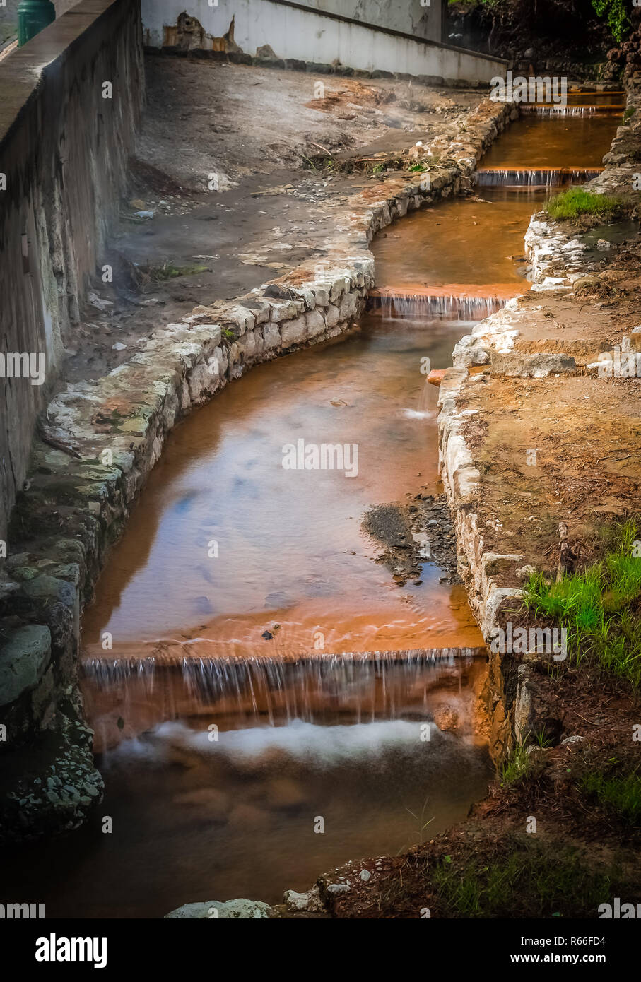 Geothermal water stream Stock Photo - Alamy