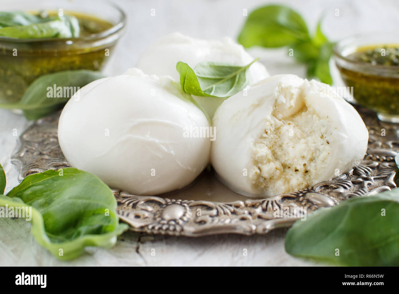 Italian mozzarella cheese stuffed with ricotta and persto Stock Photo ...