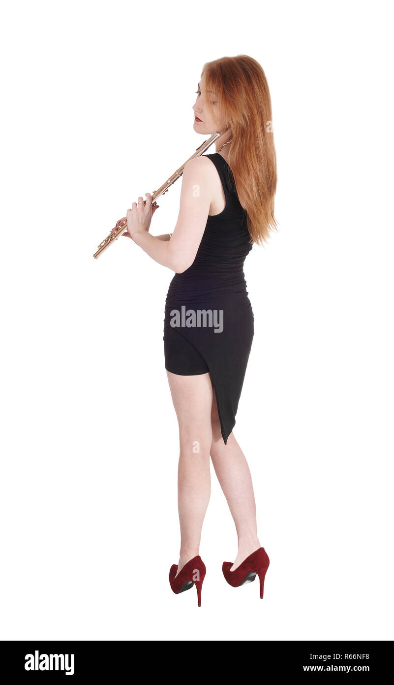 Woman standing from back, holding her flute Stock Photo - Alamy