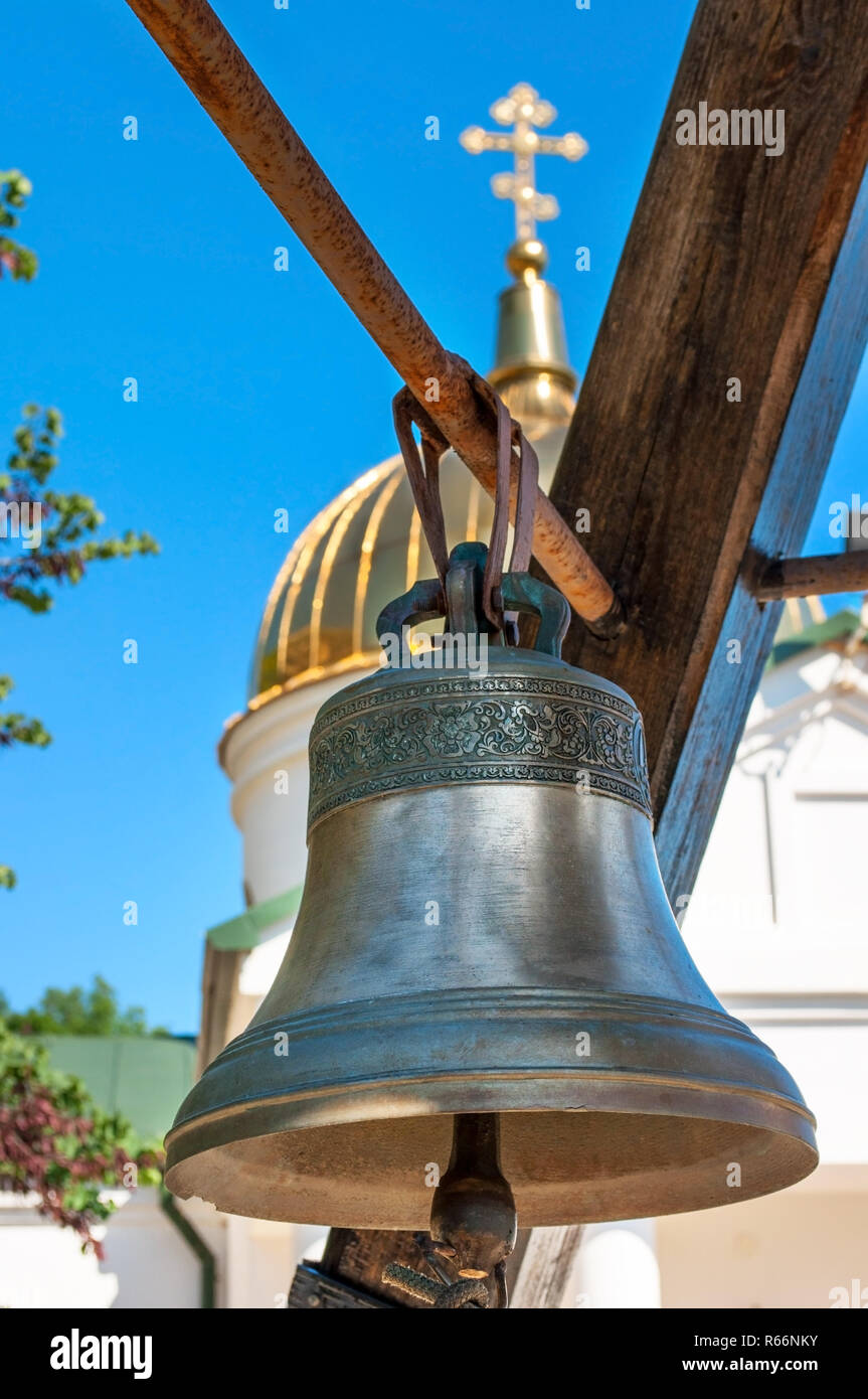 Copper bell on the background of the church Stock Photo - Alamy