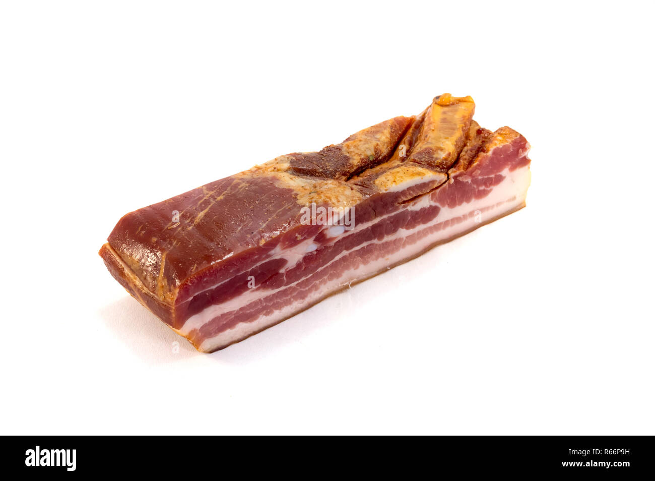 Block of bacon smoked pork with its meat and fat lines on a white ...