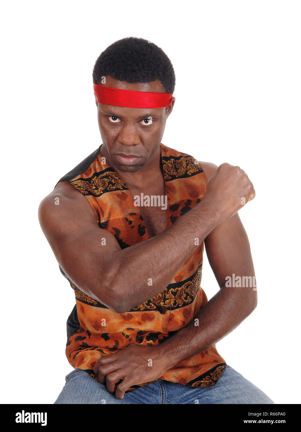 Serious looking African man in a vest Stock Photo - Alamy