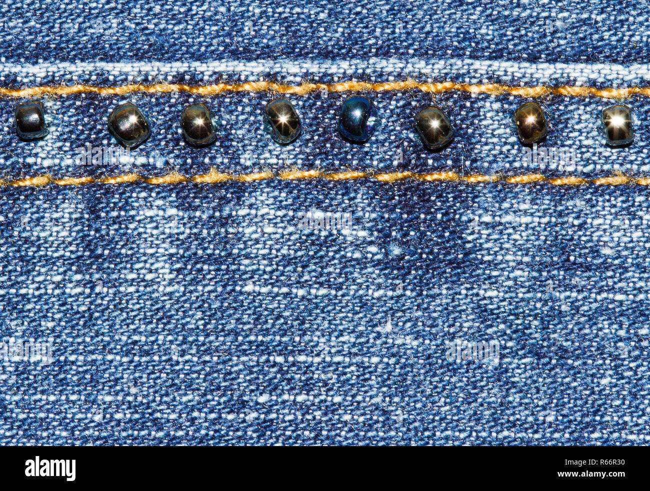 Blue jeans texture background and button and seam Stock Photo - Alamy