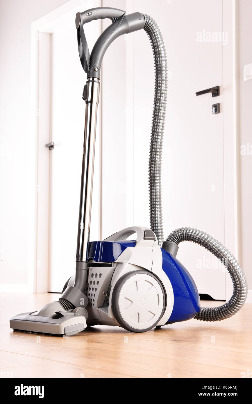 Canister vacuum cleaner for home use on the floor panels Stock Photo ...