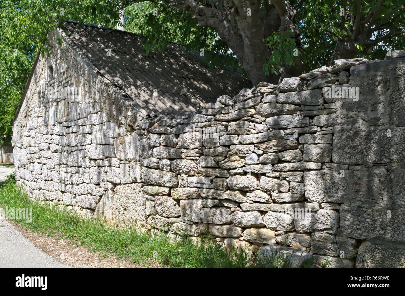 Mediterranean style stone house and fence Stock Photo - Alamy