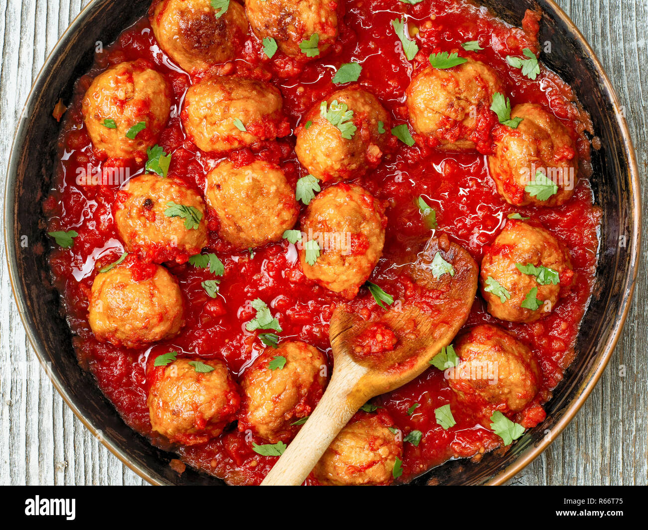 rustic italian meatball in tomato sauce Stock Photo - Alamy