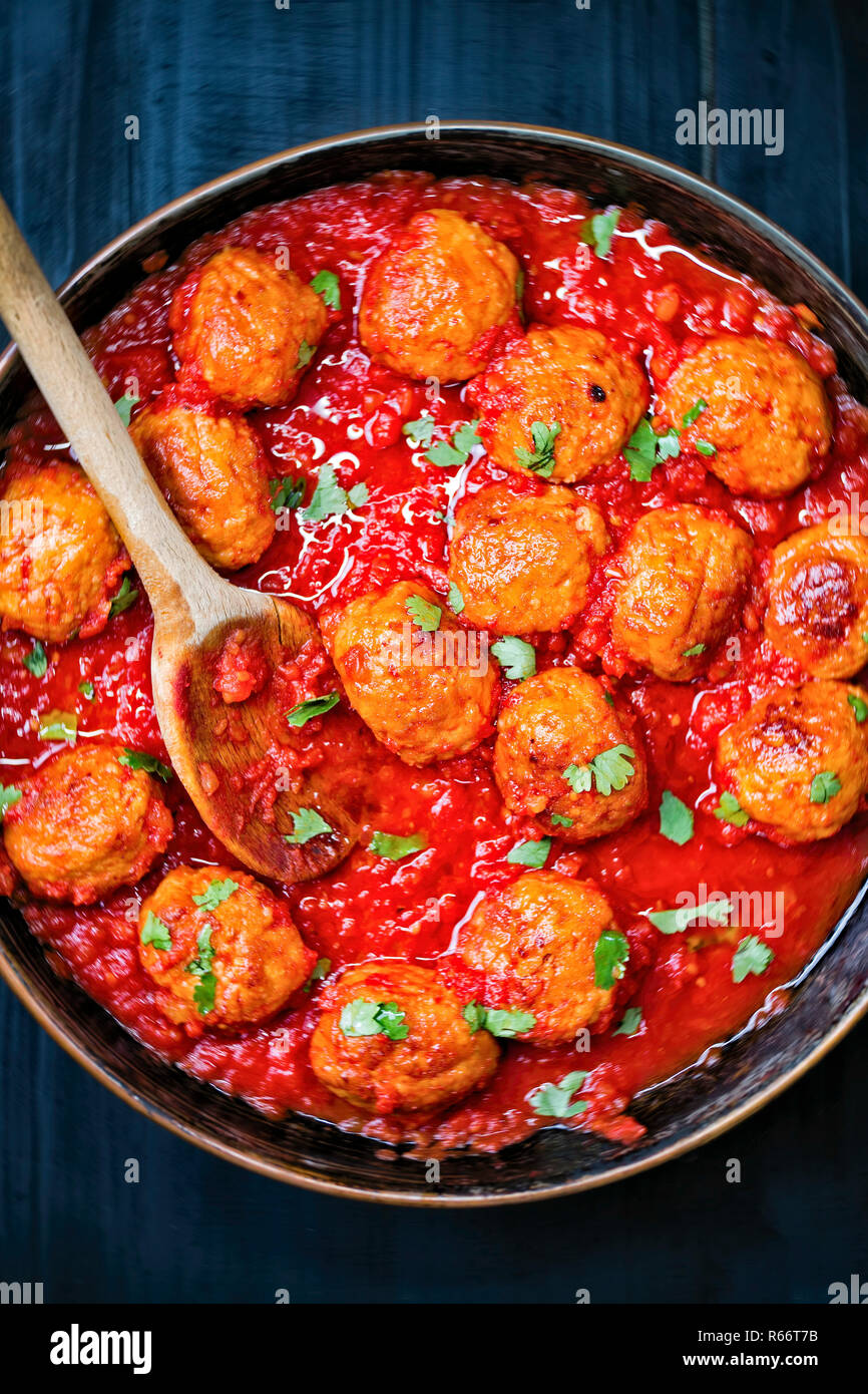 rustic italian meatball in tomato sauce Stock Photo - Alamy