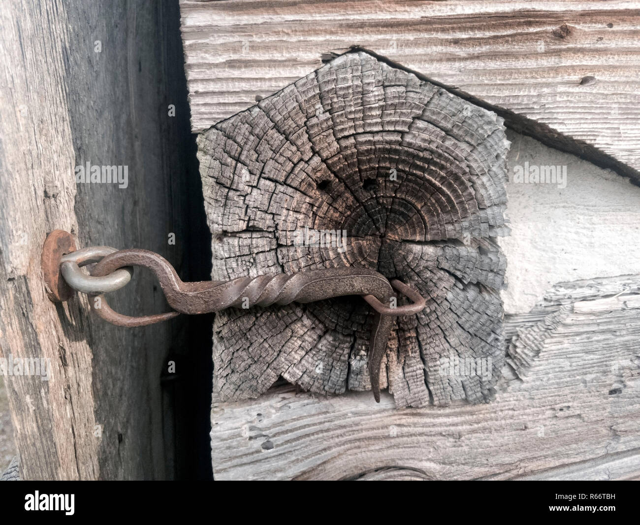 Closeup of wrought iron hook and eye fastener Stock Photo - Alamy