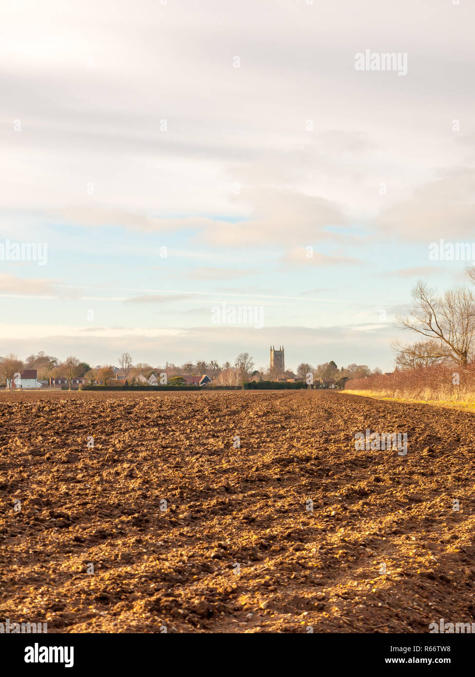 brown ploughed agricultural field outside farm landscape sky ground ...