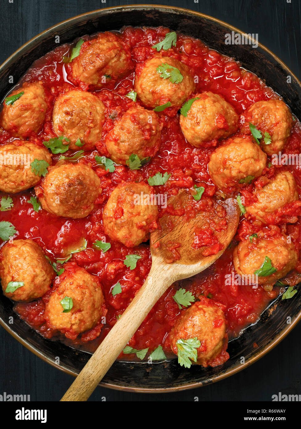 rustic italian meatball in tomato sauce Stock Photo - Alamy