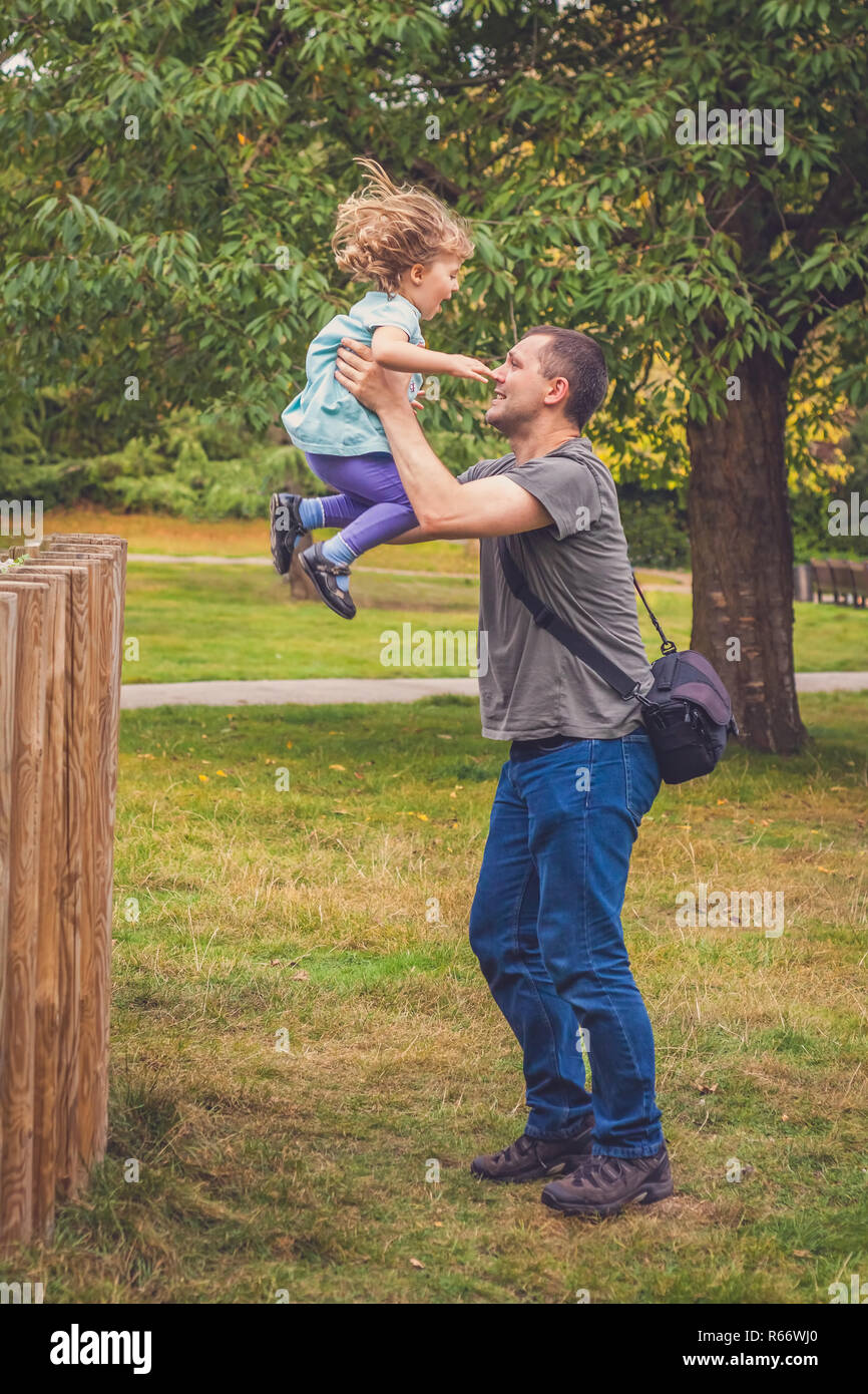 Father catching daughter Stock Photo - Alamy