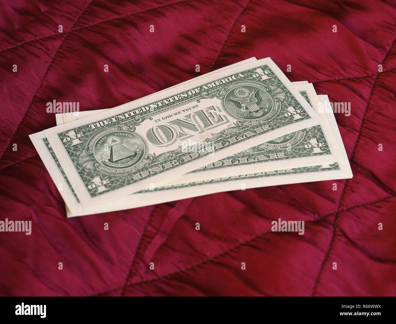 One Dollar notes, United States over red velvet background Stock Photo ...
