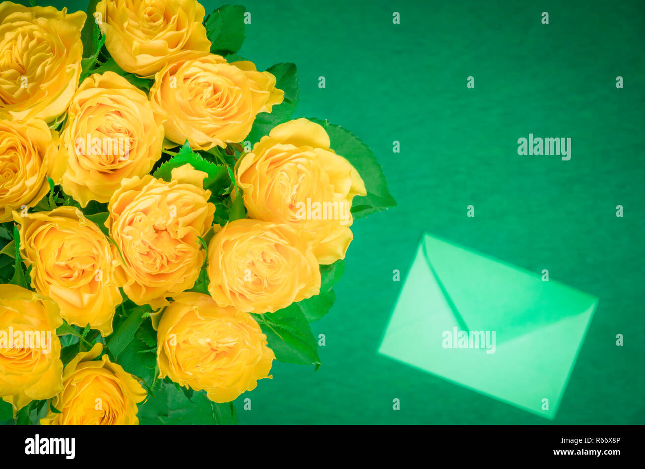 Yellow roses bouquet and a letter Stock Photo - Alamy