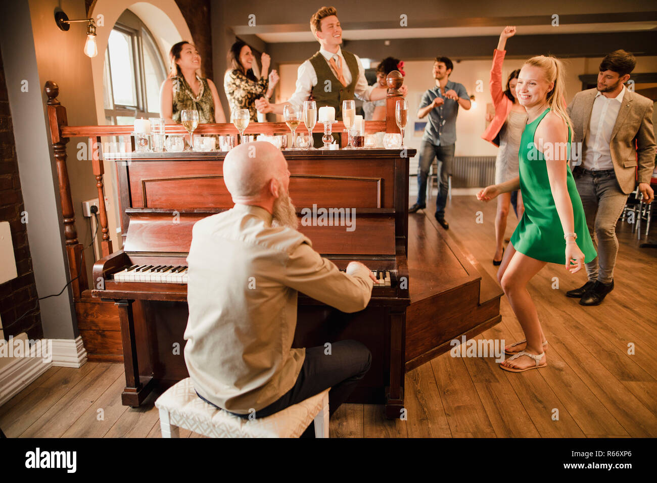 Wedding Guests Having Fun With The Piano Stock Photo - Alamy