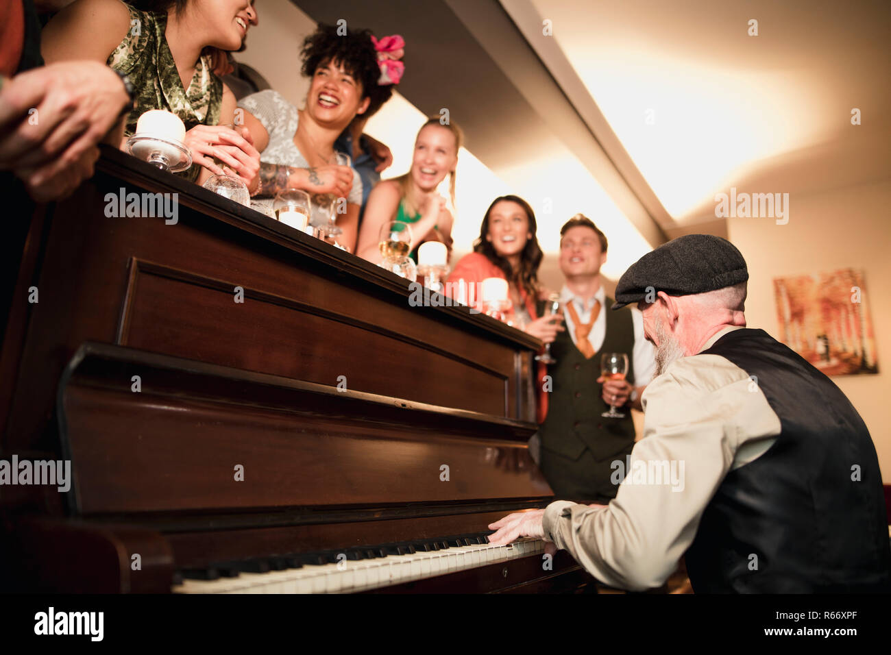 Wedding Guests Having Fun With The Piano Stock Photo - Alamy