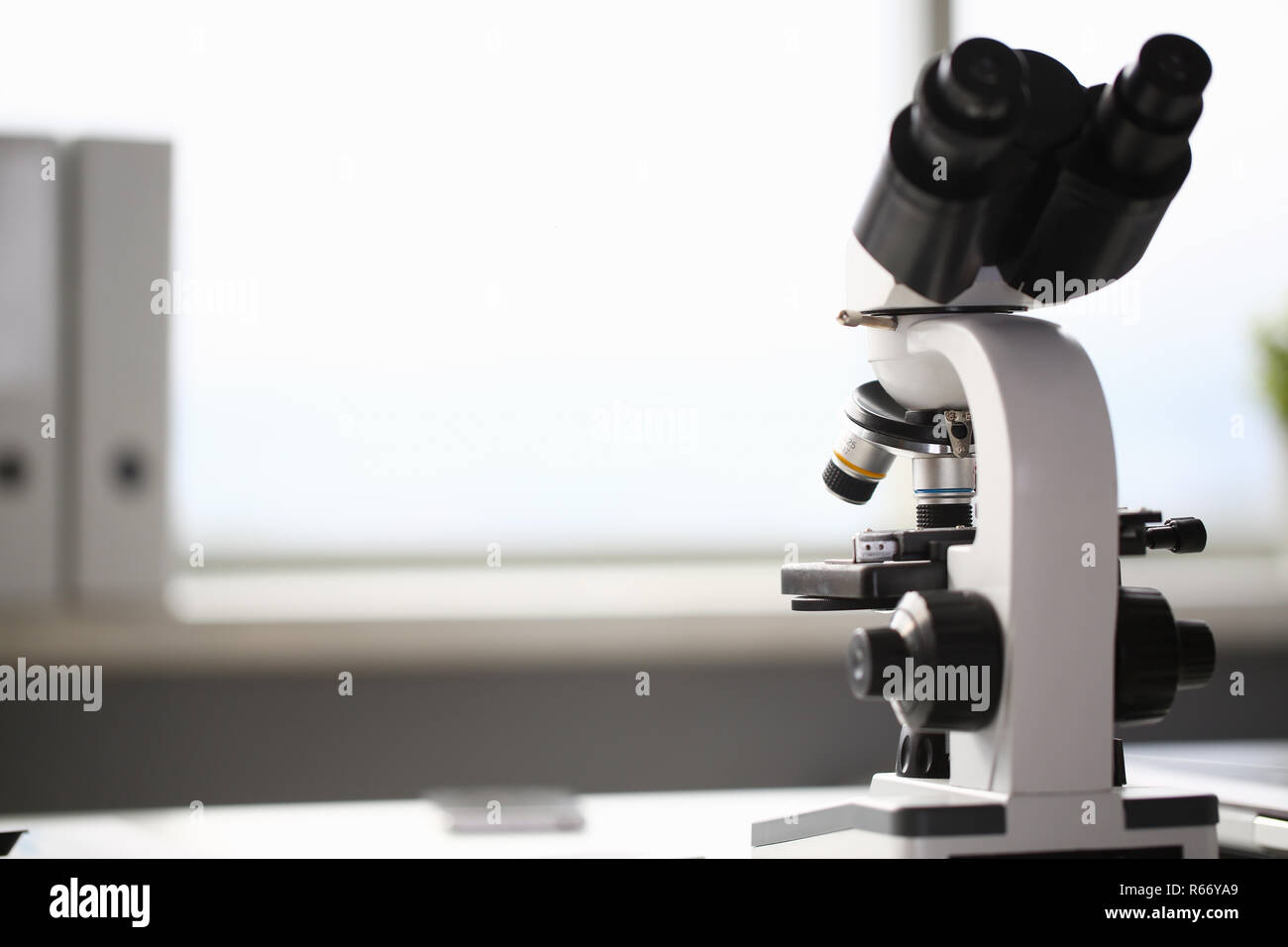The head microscope on the background laboratory Stock Photo - Alamy