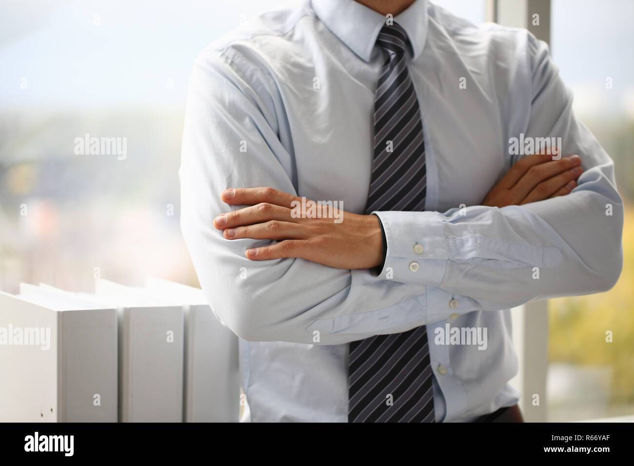 Male hands in suit crossed on chest closeup background Stock Photo - Alamy