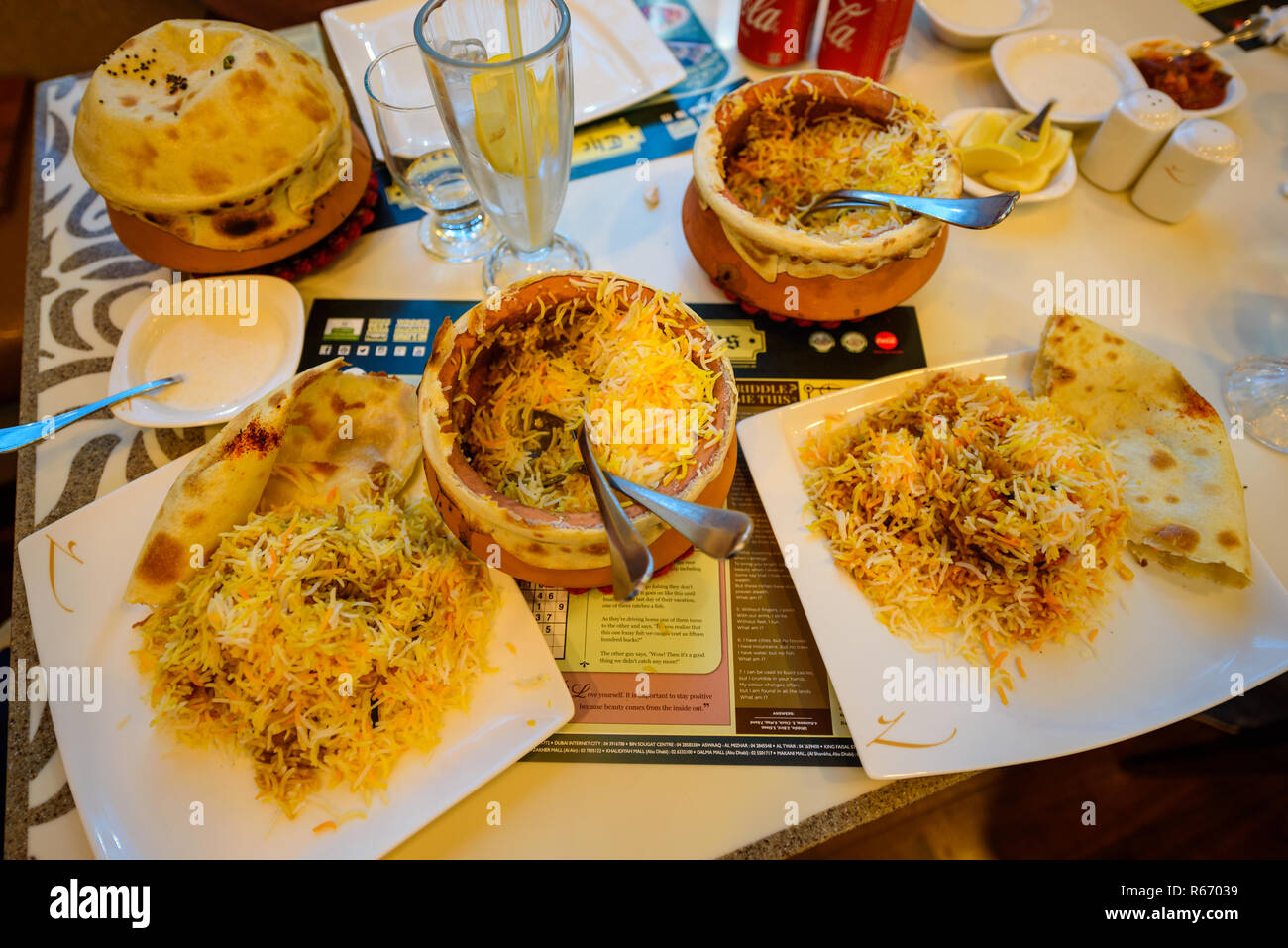 Dubai, United Arab Emirates - July 2018: Table Top view showing various ...
